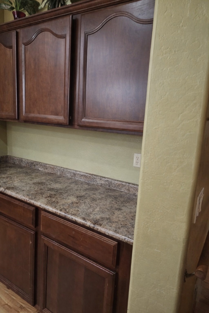 Warm kitchen workspace with lovely cabinets | Gerchick Real Estate